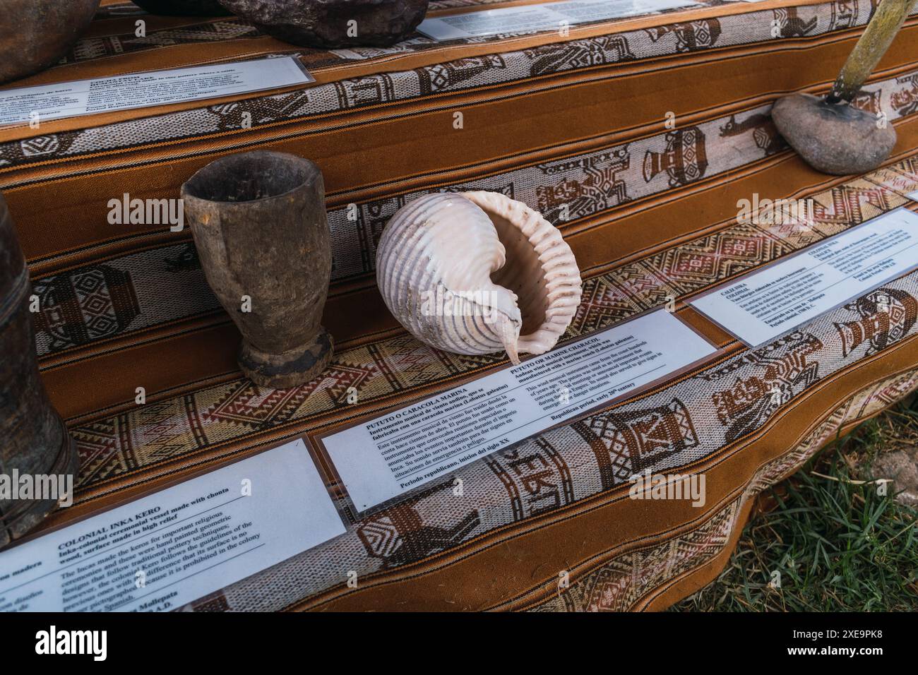 ceramics in the incas on a traditional table with traditional blanket ...
