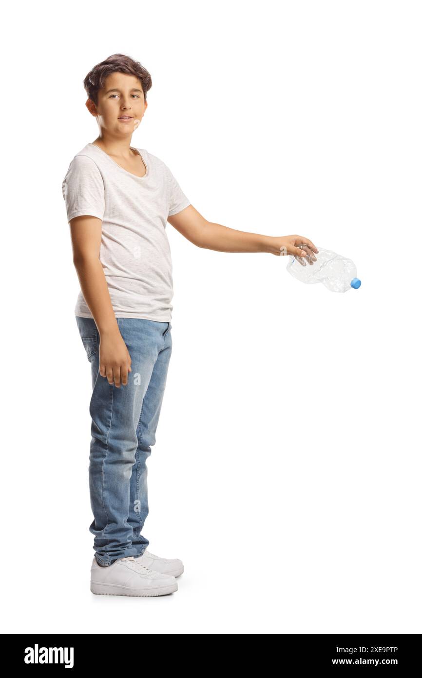 Boy throwing a plastic bottle and looking at camera isolated on white ...