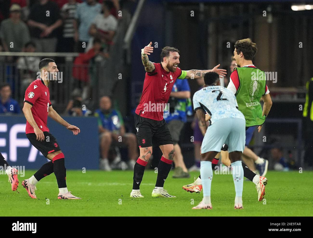 Georgia players celebrate reaching the round of 16 following the UEFA ...