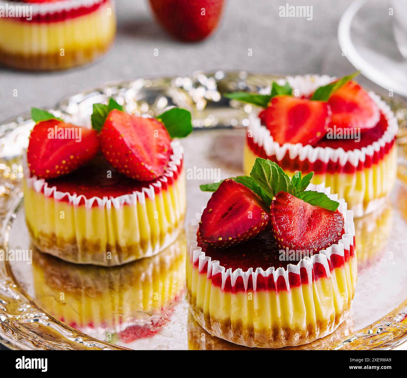 Mini strawberry cheesecake in muffin forms Stock Photo - Alamy