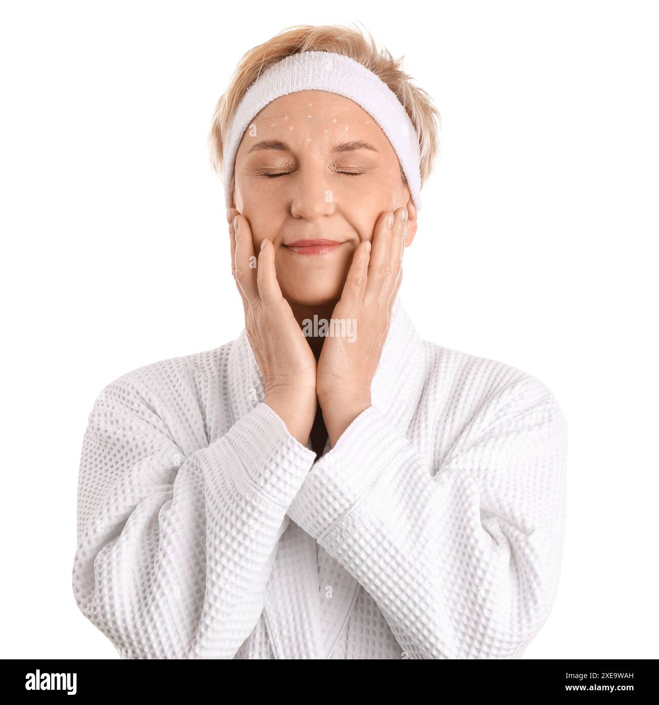 Mature woman with marked face for filler injections on white background ...