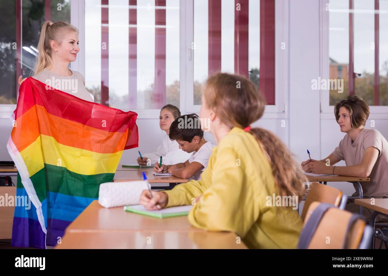 Progressive female teacher discussing with teenage students about LGBT ...