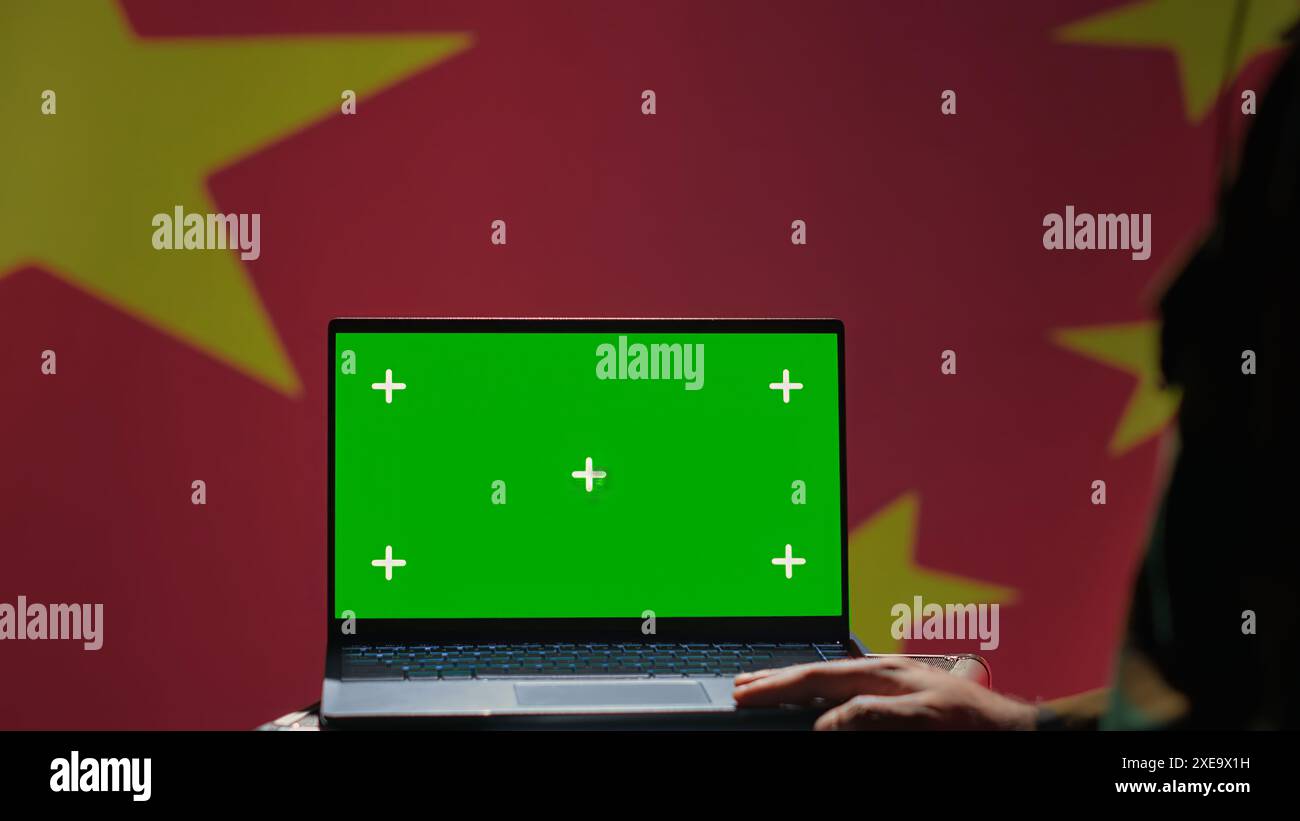 Chinese soldier using military tech on green screen laptop to identify ...