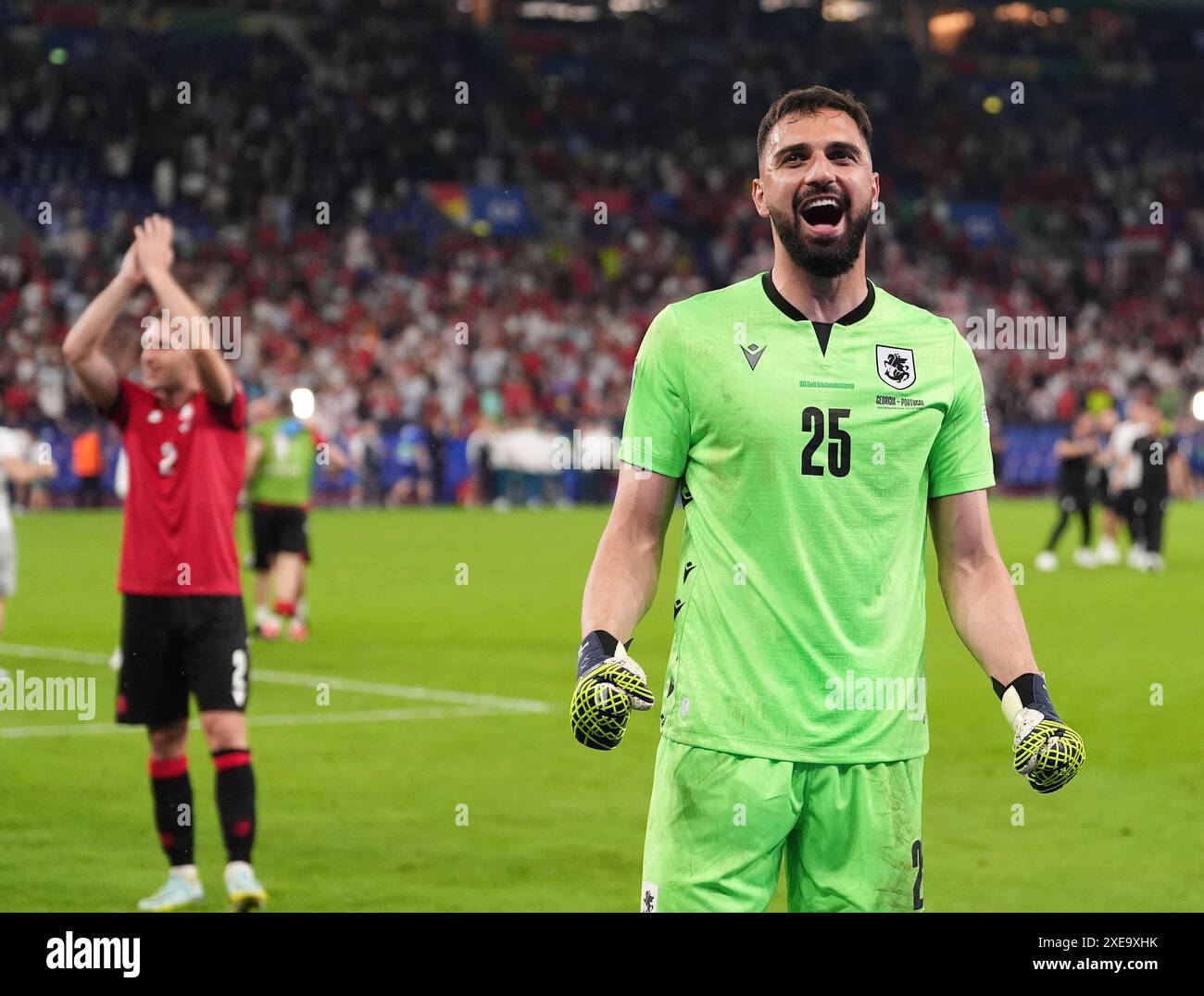 Georgia goalkeeper Giorgi Mamardashvili celebrates their side’s victory ...