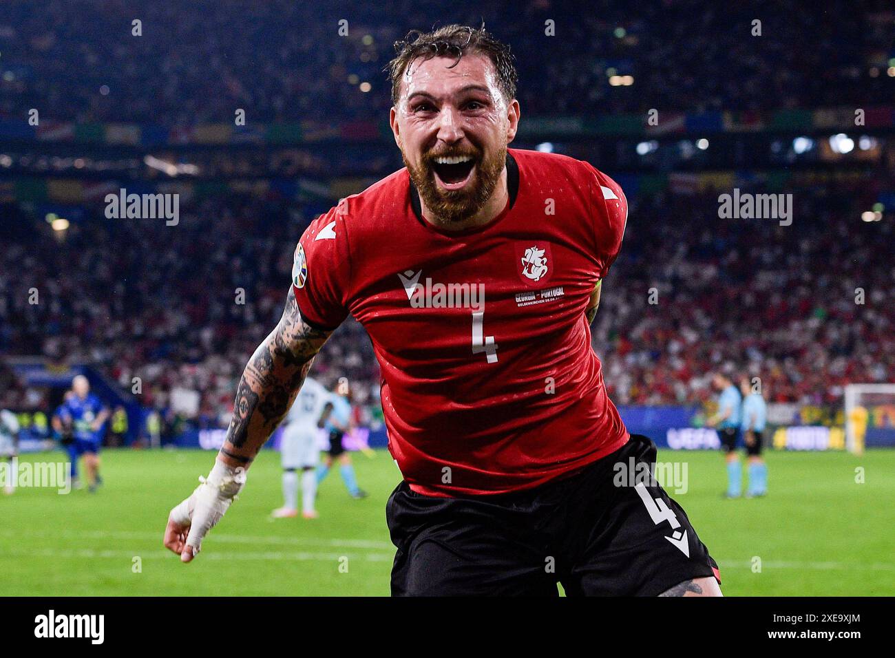 GELSENKIRCHEN, GERMANY - JUNE 26: Guram Kashia of Georgia celebrates ...