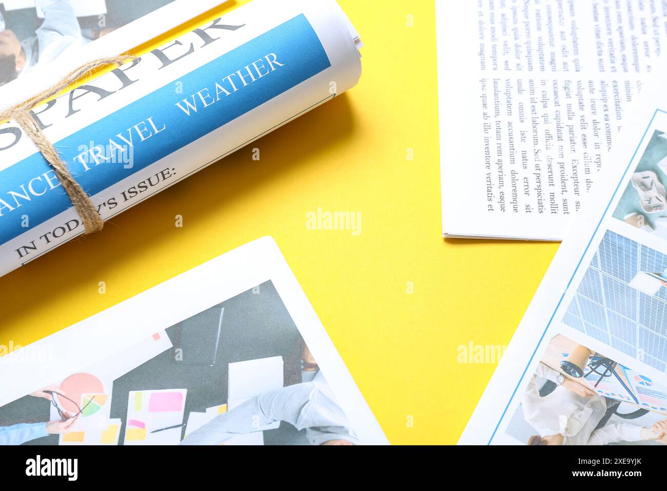 Different newspapers on yellow background Stock Photo - Alamy
