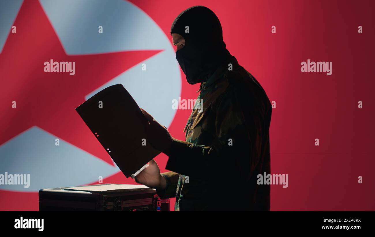 North Korean spy taking out intel document from suitcase to identify ...