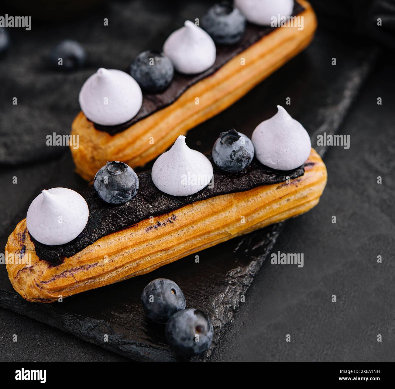 Board sweet chocolate eclairs hi-res stock photography and images - Alamy