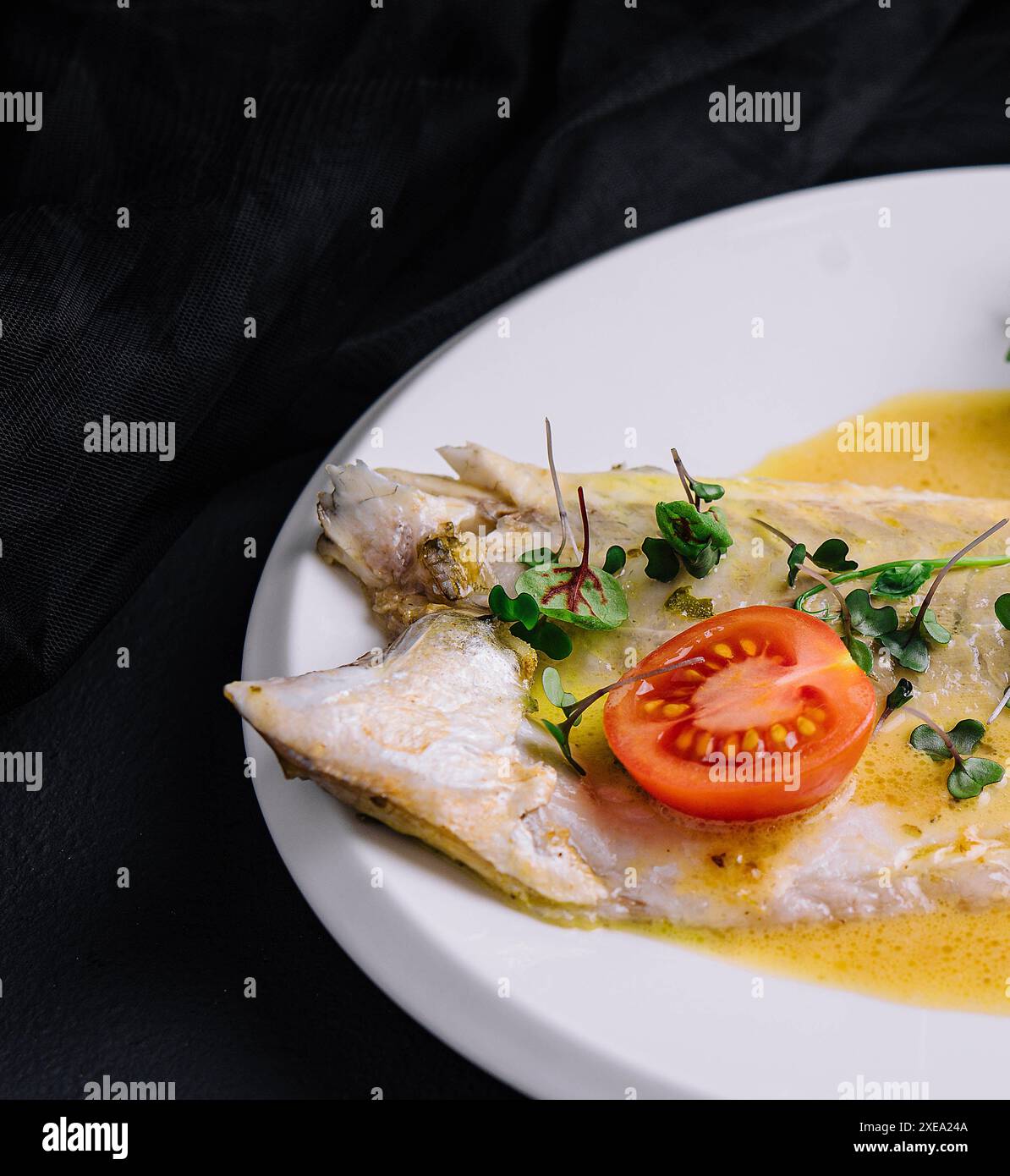 Fish in white sauce hi-res stock photography and images - Alamy
