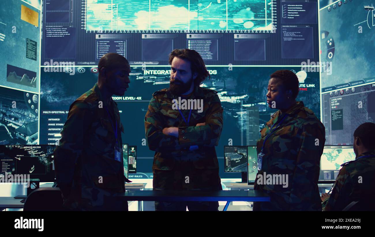 Brigadier general and his staff studying radar data on a holographic ...