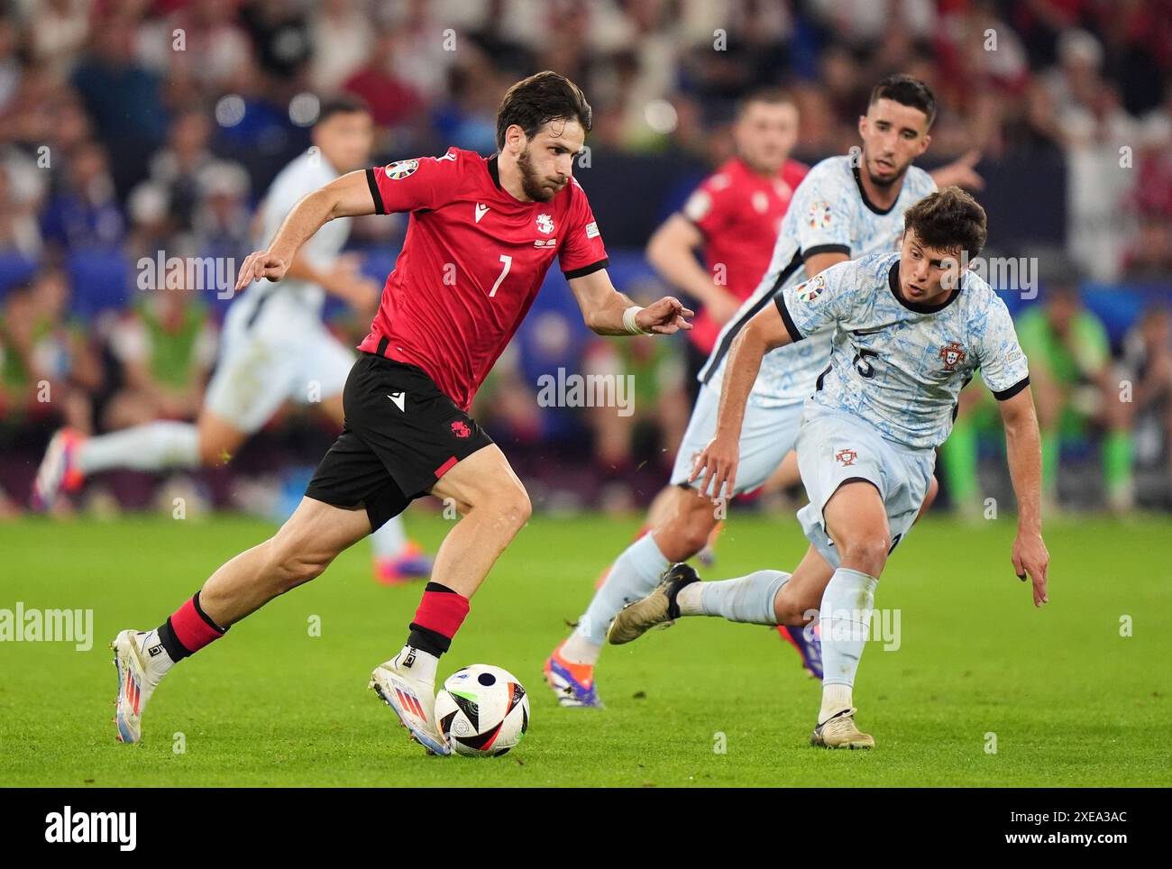 Georgia's Khvicha Kvaratskhelia in action against Portugal's Joao Neves ...