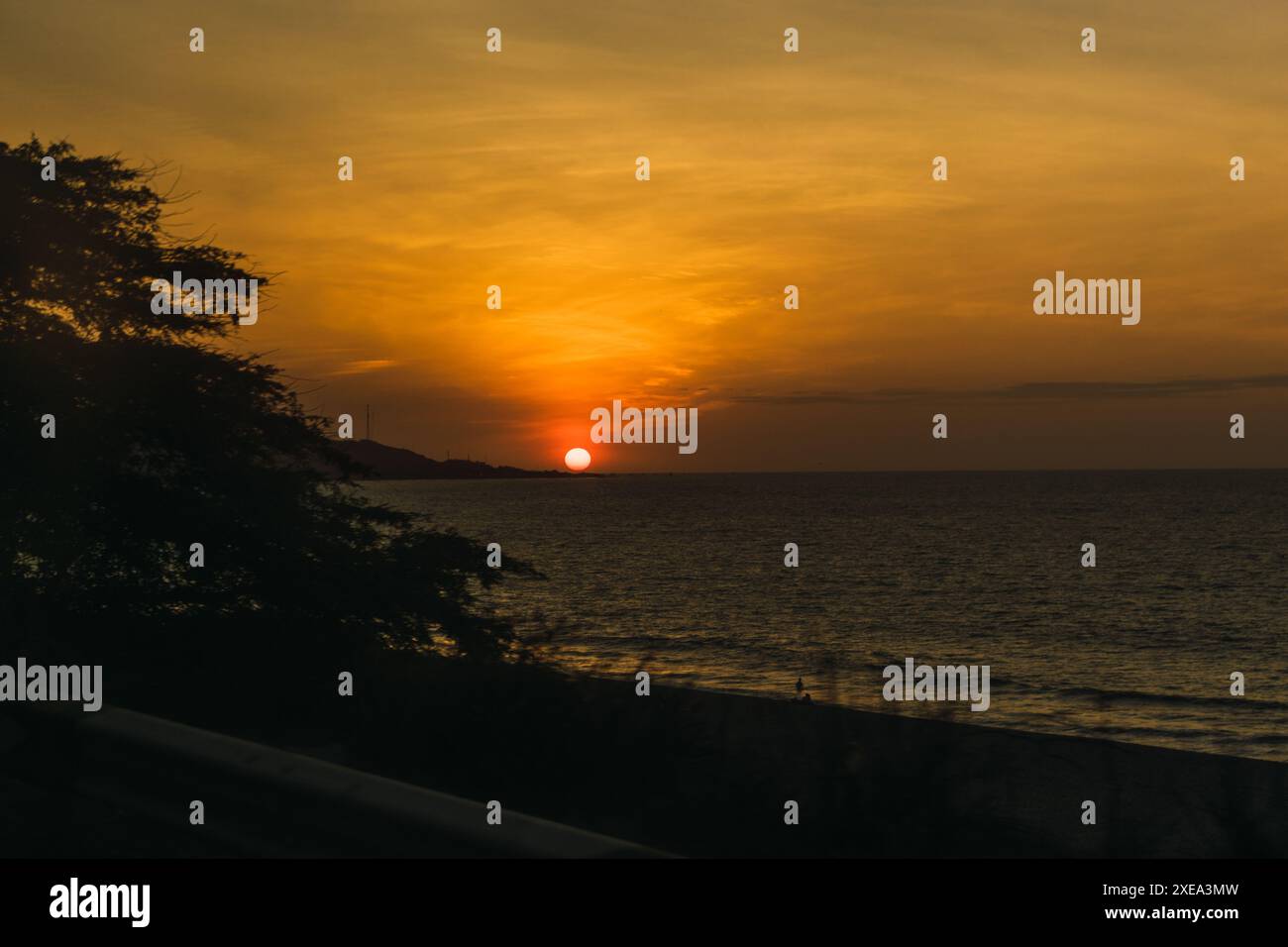 sunset with red sky with clouds on the beach in Latin America Stock ...