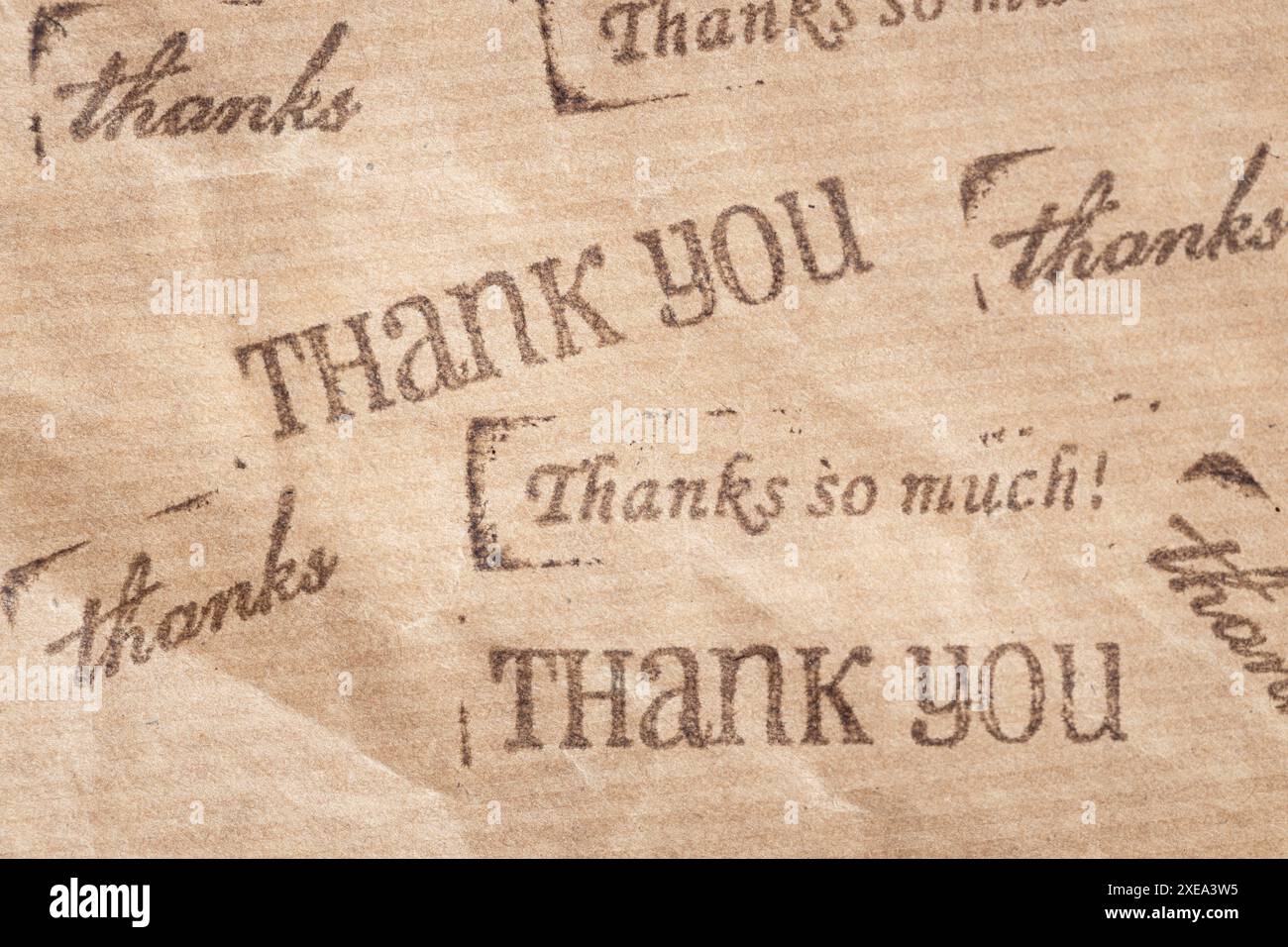 Ink stamp of Thank you messages on kraft paper. Full frame Stock Photo ...