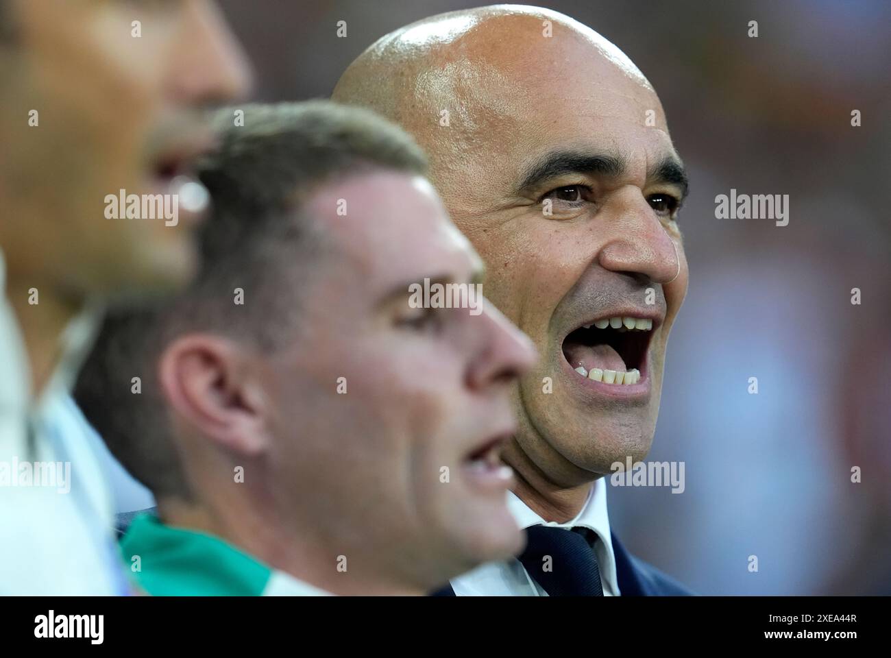 Portugal manager Roberto Martinez (right) sings a national anthem ahead ...