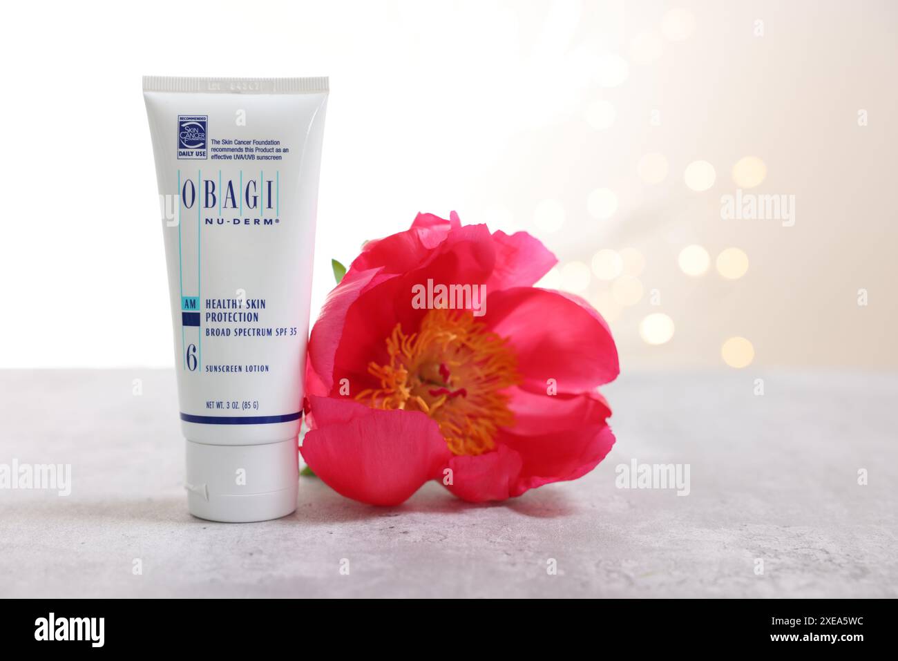 Leiden, Netherlands - June 11, 2024: Tube of Obagi sunscreen and peony ...