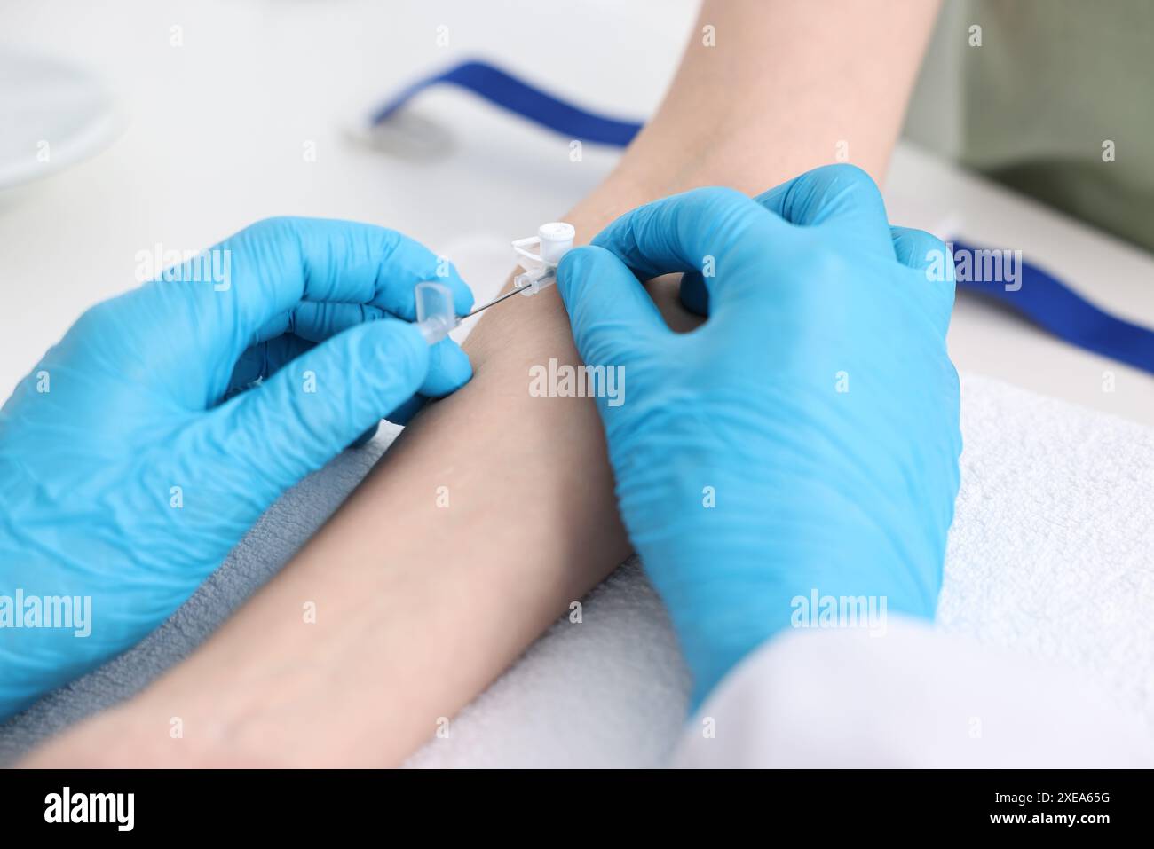 Nurse inputting catheter for IV drip in patient hand, closeup Stock ...