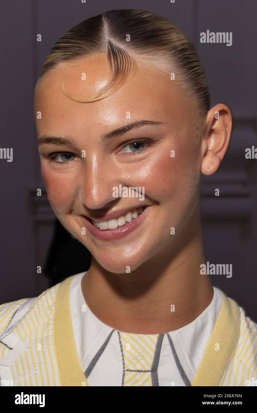 Mia Regan poses for photographers at the Thom Browne Haute Couture Fall ...