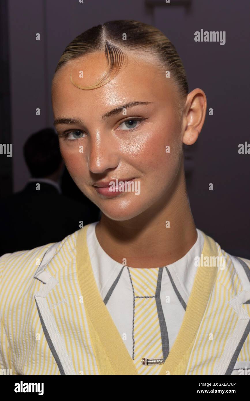 Mia Regan poses for photographers at the Thom Browne Haute Couture Fall ...