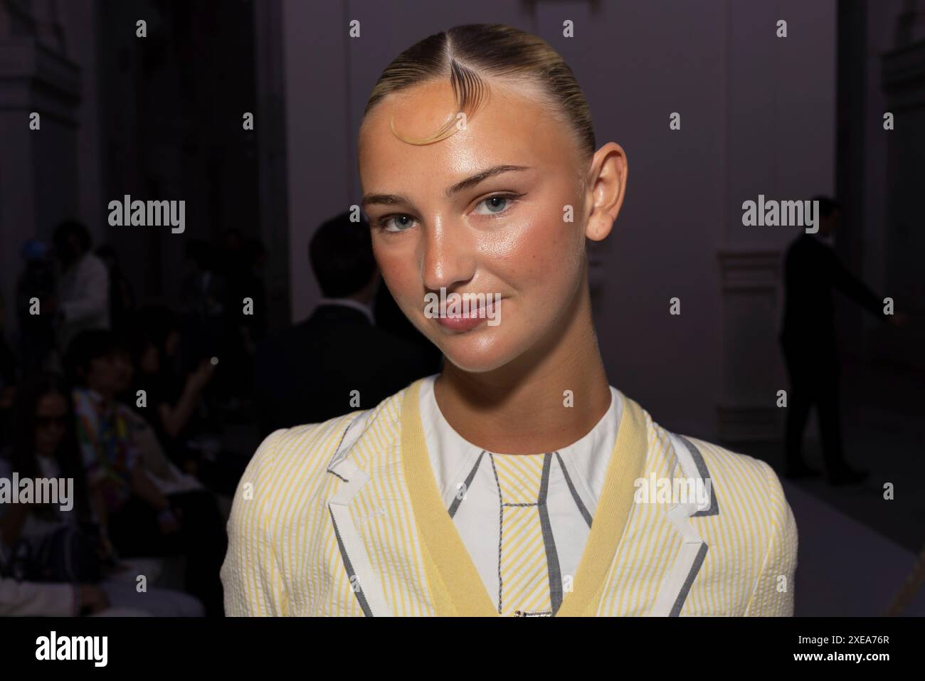 Mia Regan poses for photographers at the Thom Browne Haute Couture Fall ...