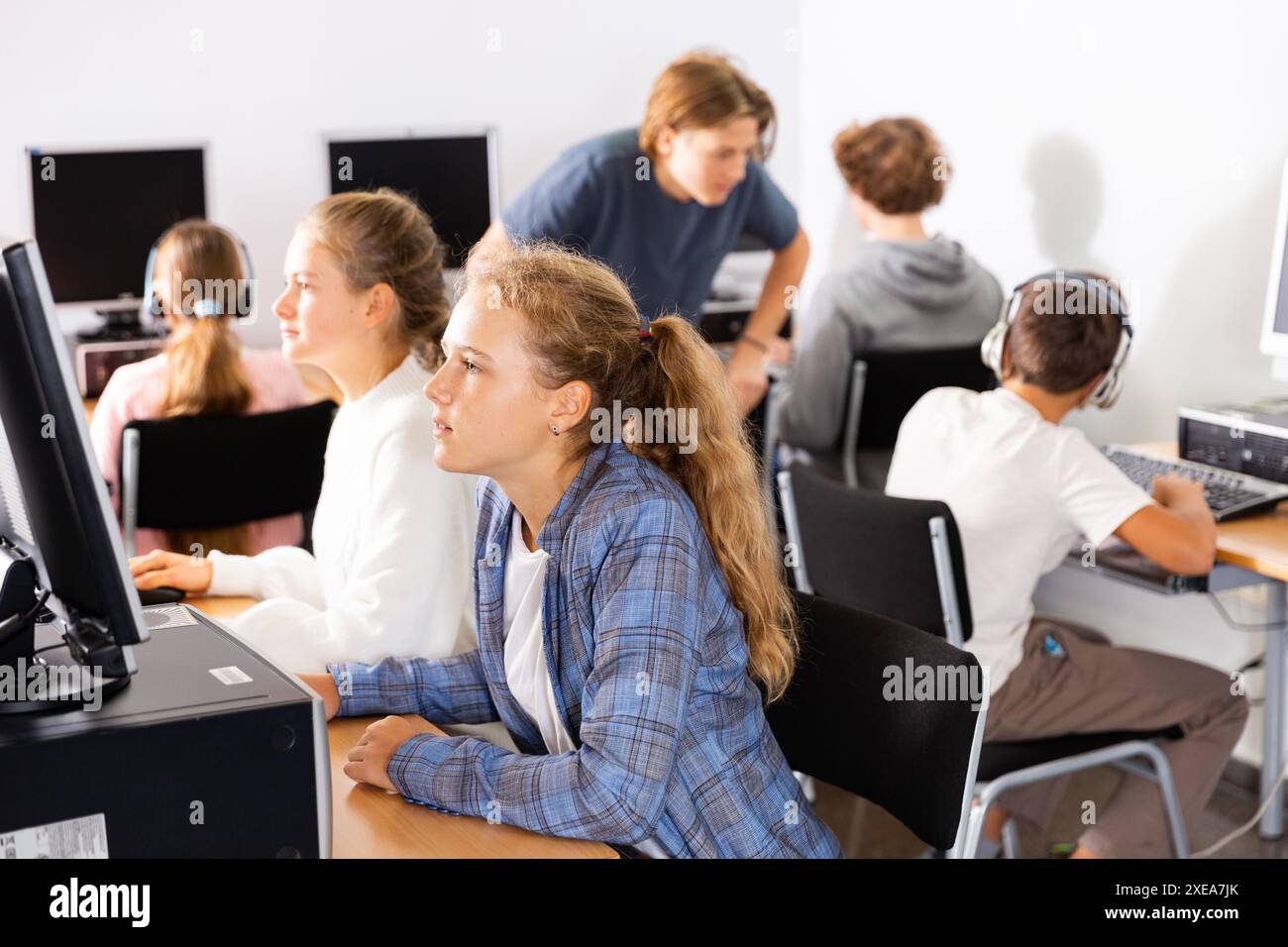 Teenager girls and boys studying in computer lab Stock Photo - Alamy