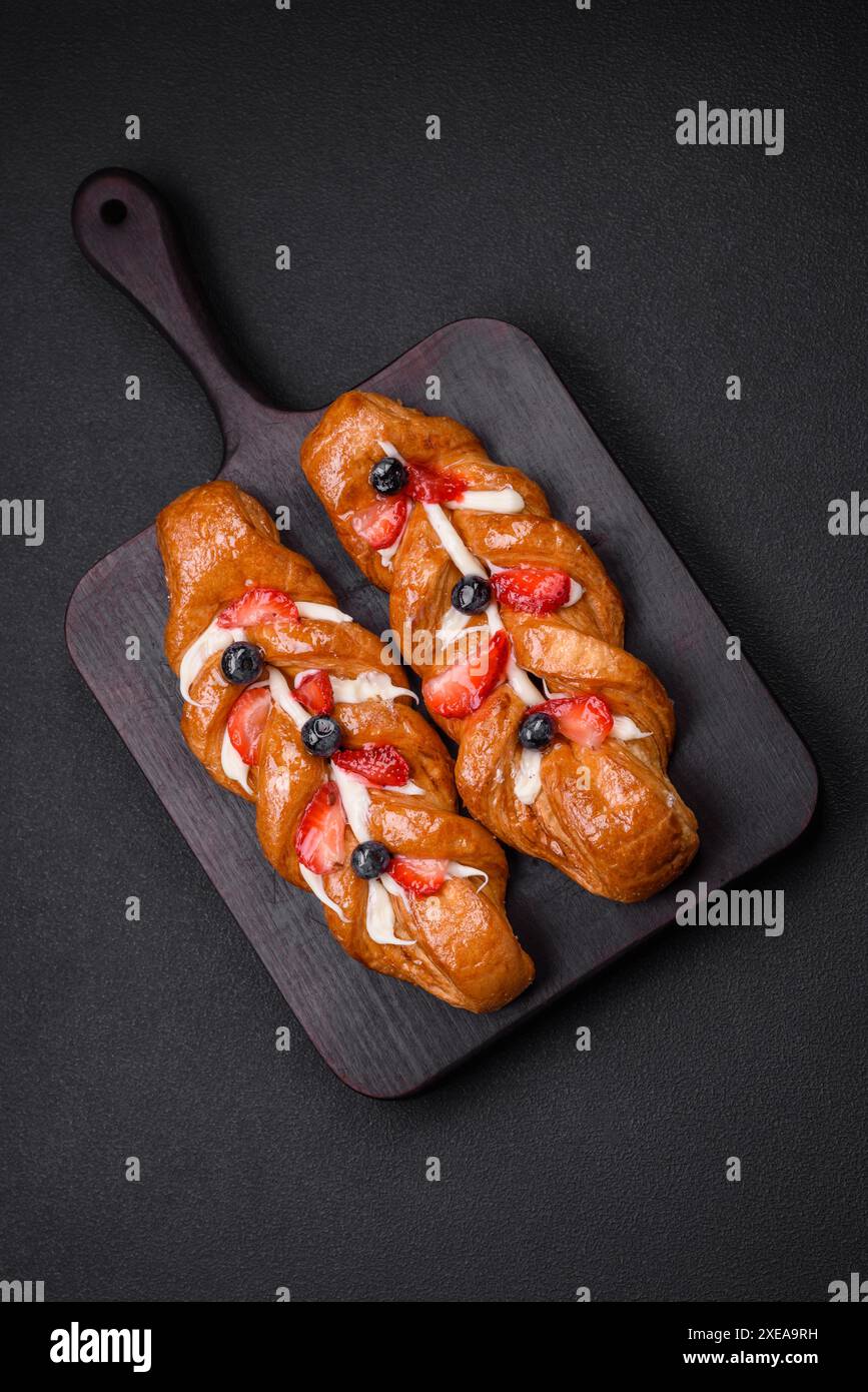 Delicious fresh crispy pastry in the form of a pigtail with ...