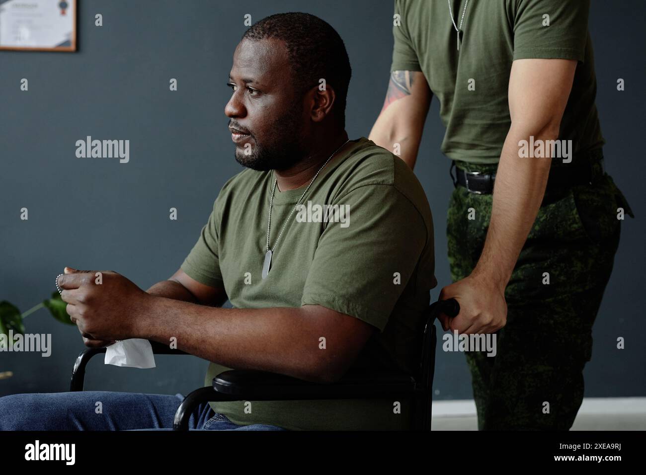 Side view portrait of grieving Black man as army veteran with ...