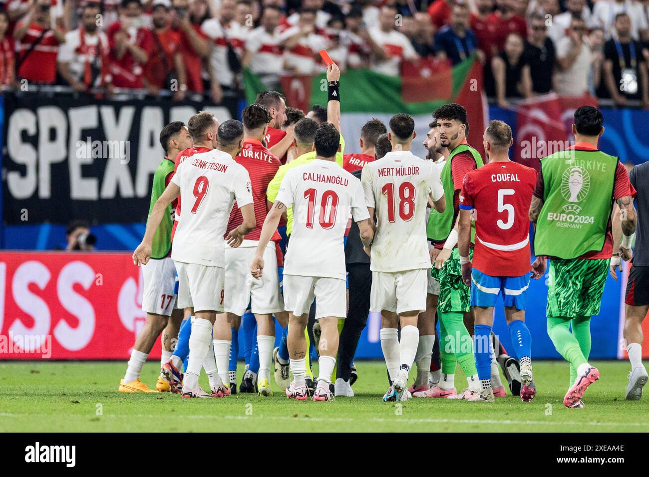 Hamburg, Germany. 26th June, 2024. Referee Istvan Kovacs hands out a ...