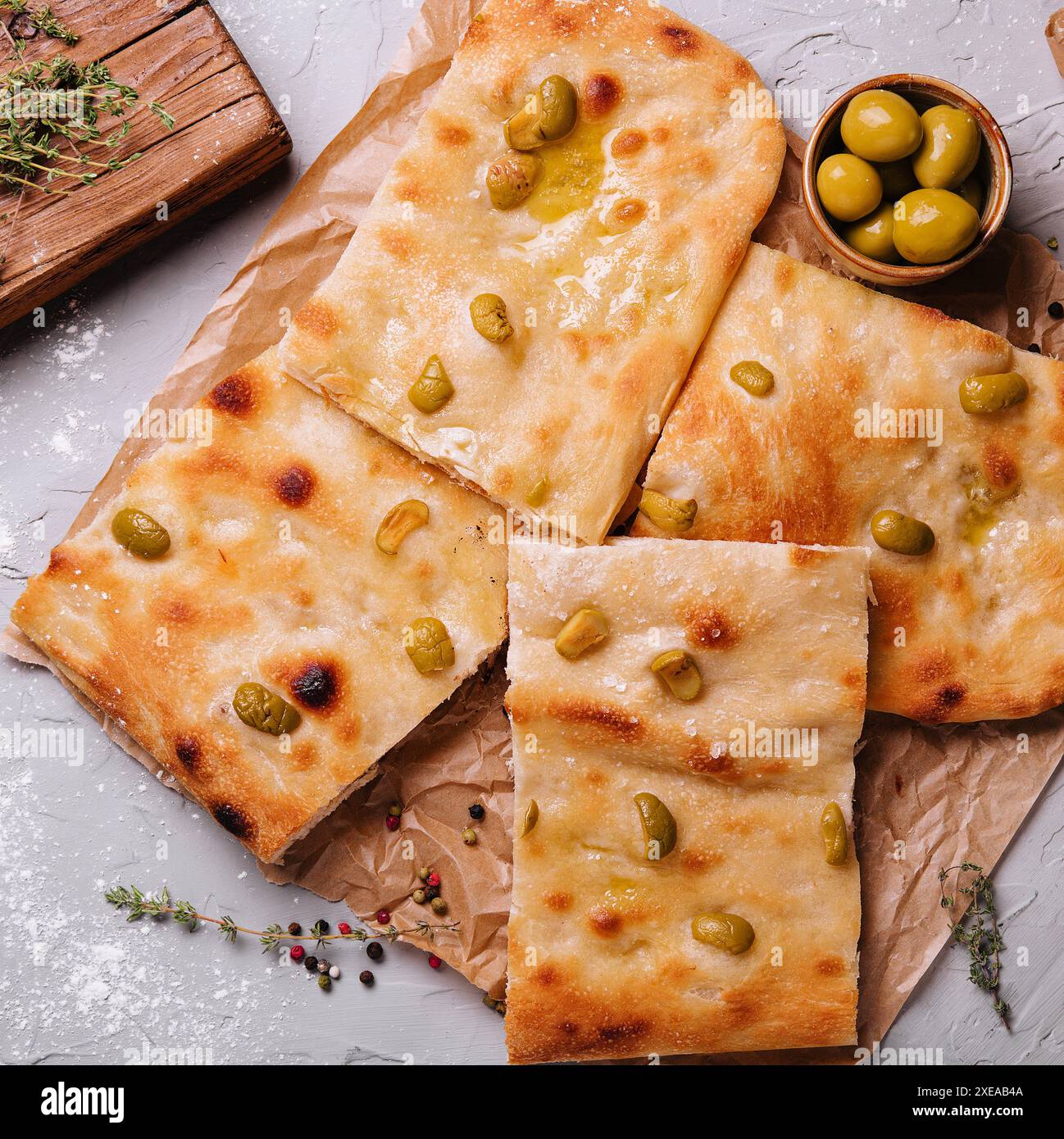Golden baked traditional Italian focaccia bread with green olives Stock ...