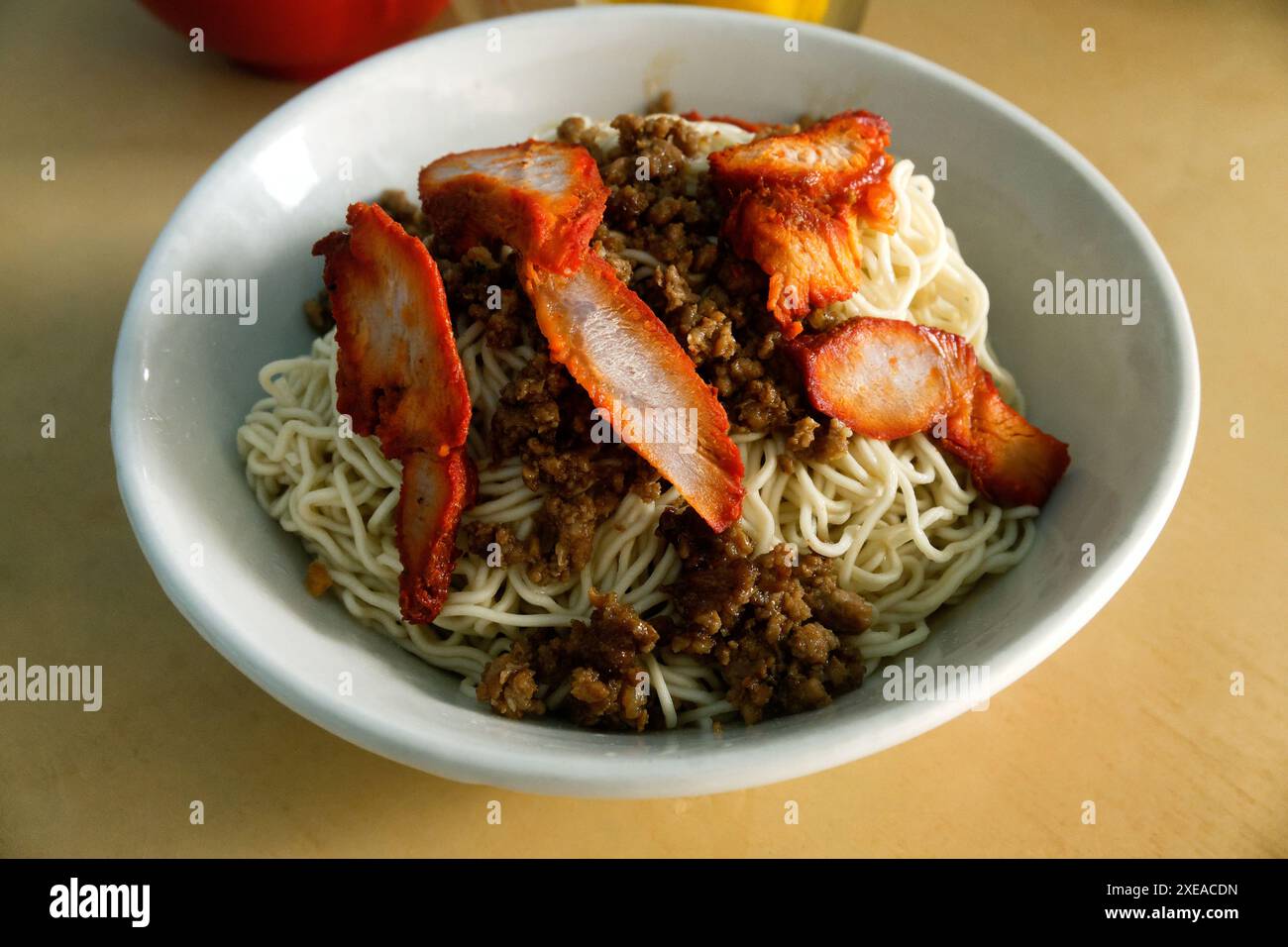 A bowl of kolo mee, the famous noodle and meat dish of Kuching, Sarawak ...