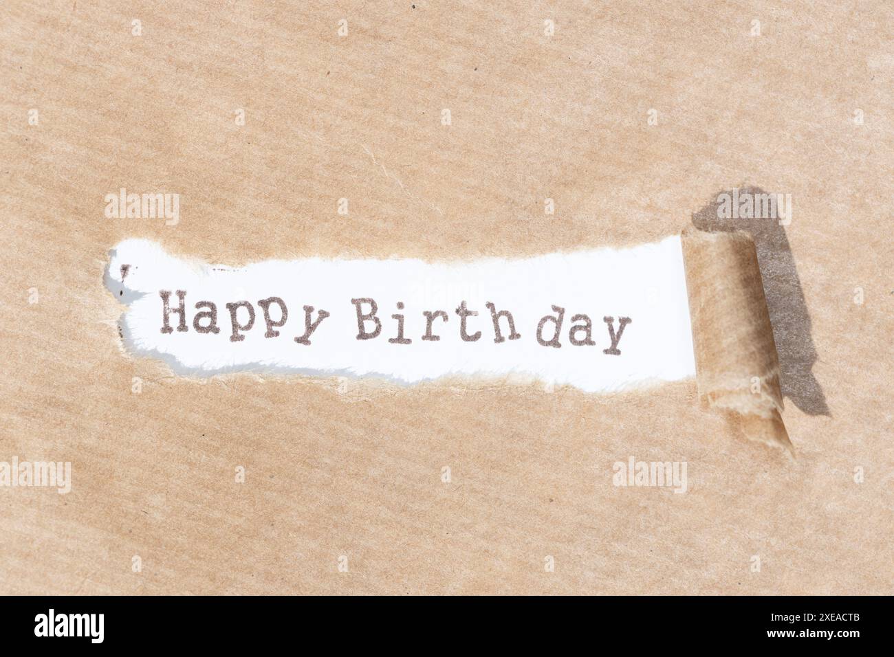 Happy Birthday message. Brown paper torn stripe with text on white ...