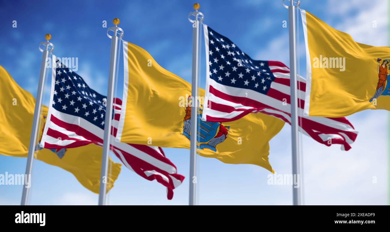 New Jersey state flags waving with the american flag on a clear day ...