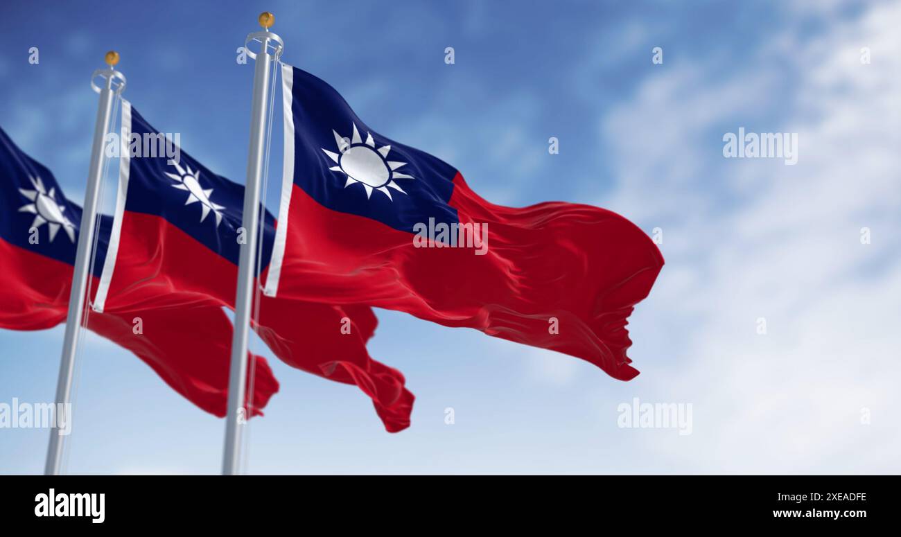Three Taiwan flags waving in the wind. Red flag with white sun with 12 ...