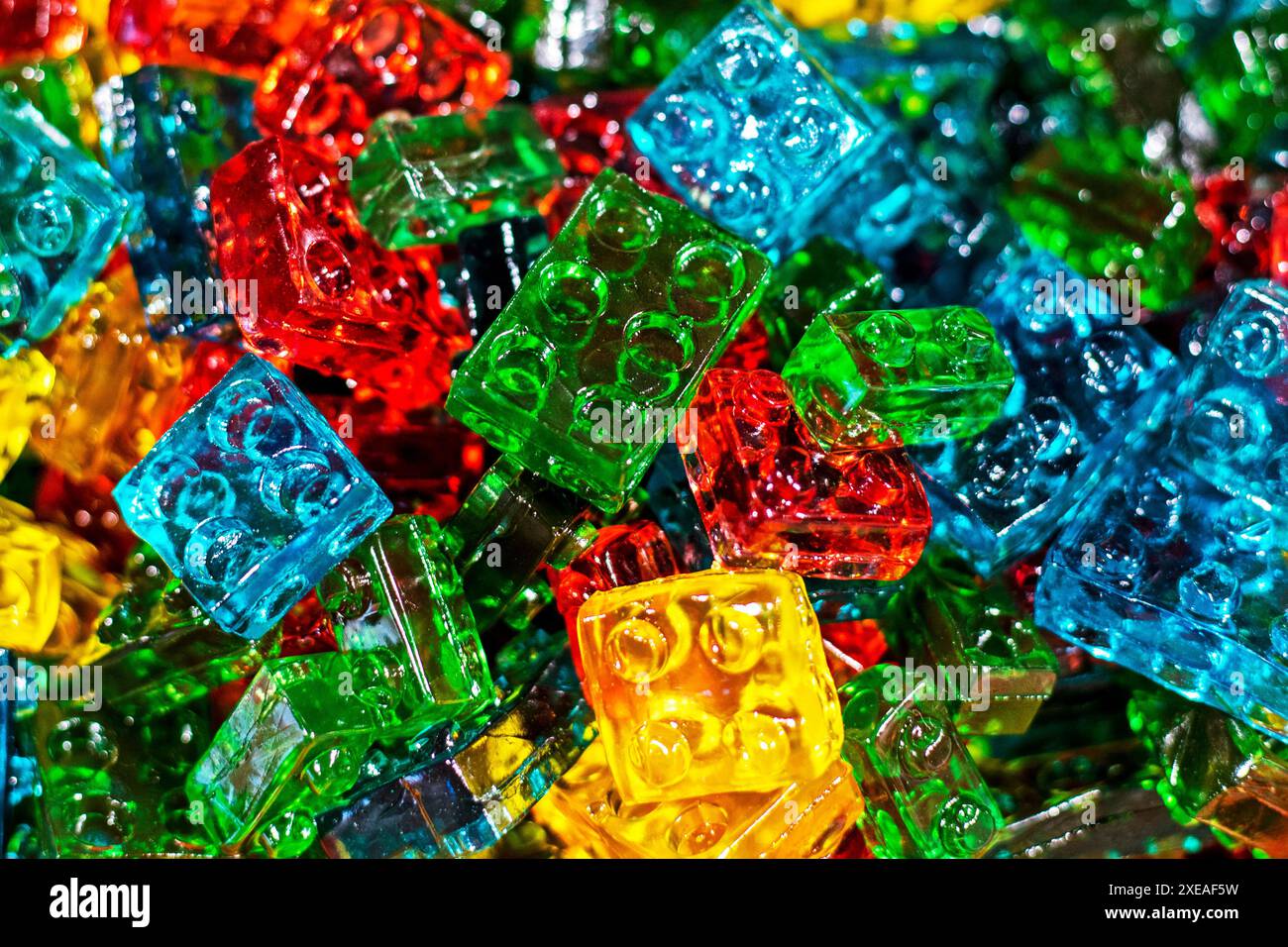 background of jelly colored candies in the shape of Lego cubes ...