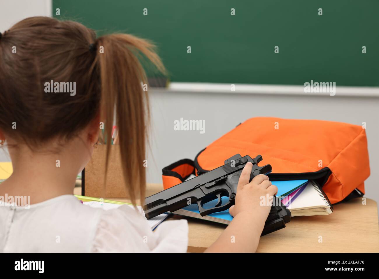 School girl gun hi-res stock photography and images - Alamy