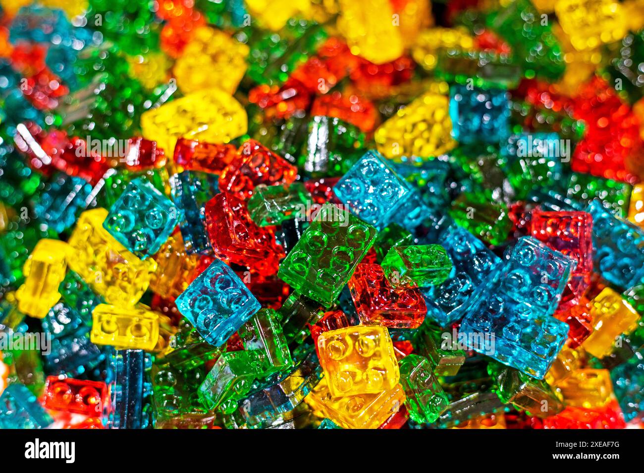 background of jelly colored candies in the shape of Lego cubes ...