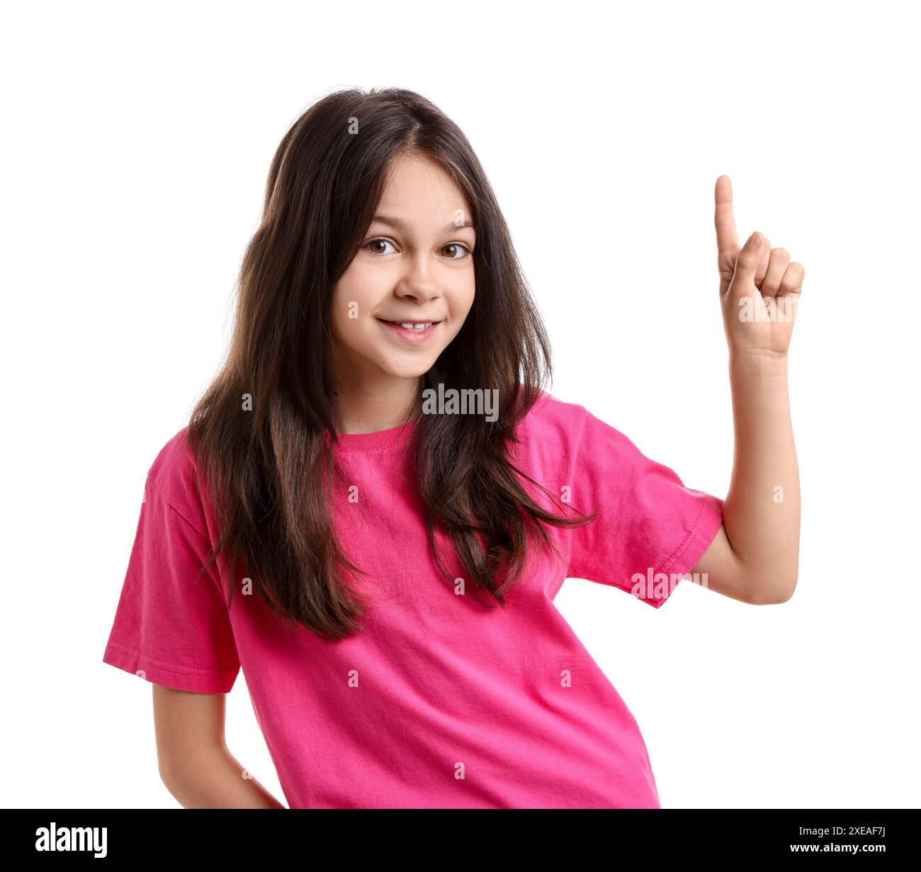 Portrait of beautiful girl pointing at something on white background ...