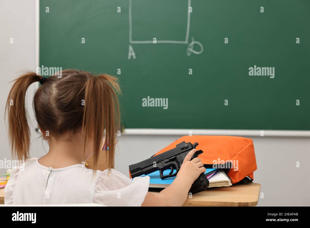 School girl with gun hi-res stock photography and images - Alamy