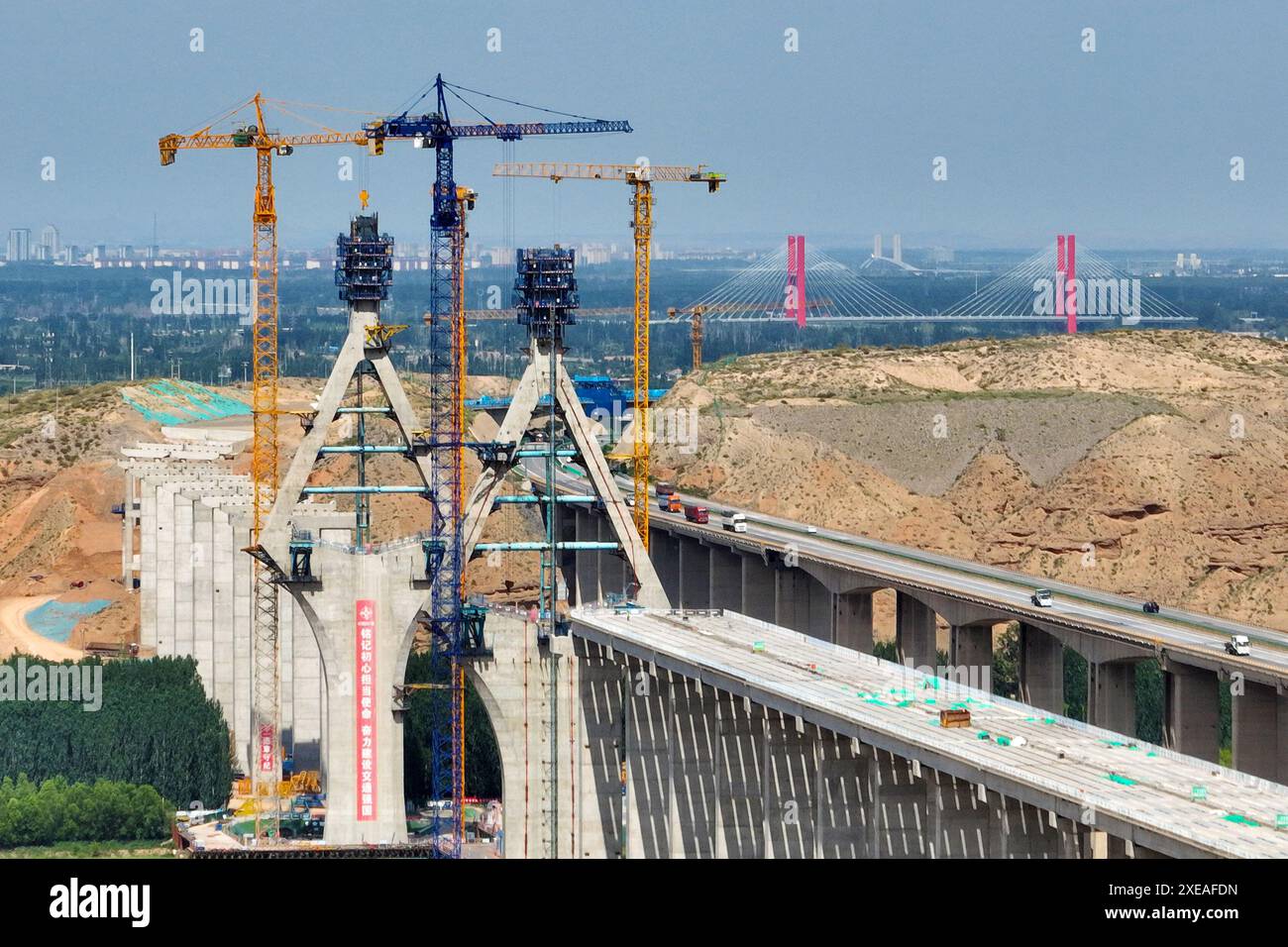 ZHONGWEI, CHINA - JUNE 26, 2024 - Construction workers work on the ...