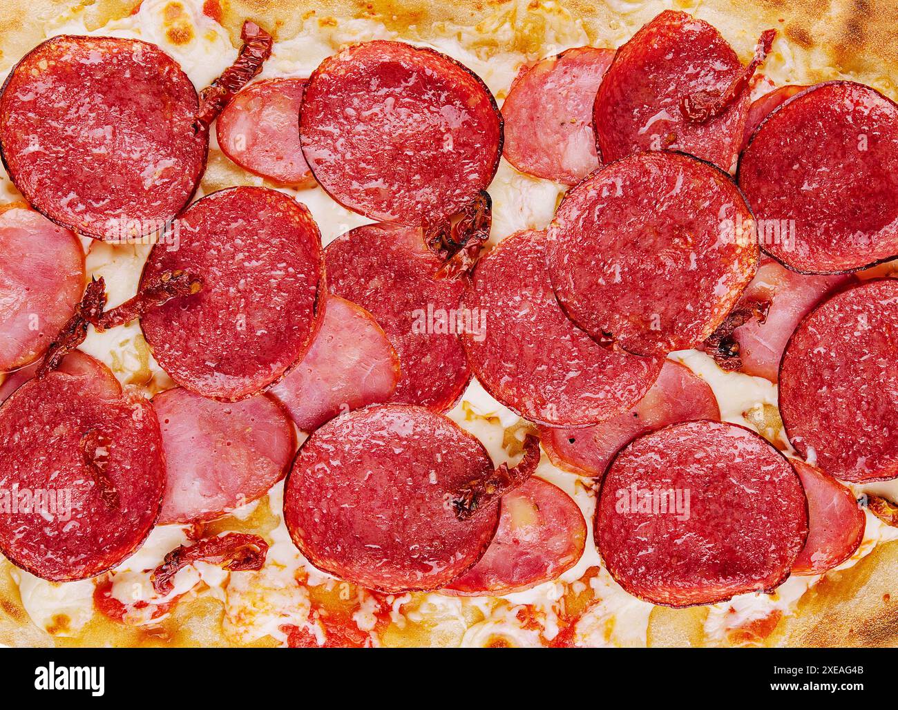 Pepperoni pizza close up background or texture Stock Photo - Alamy