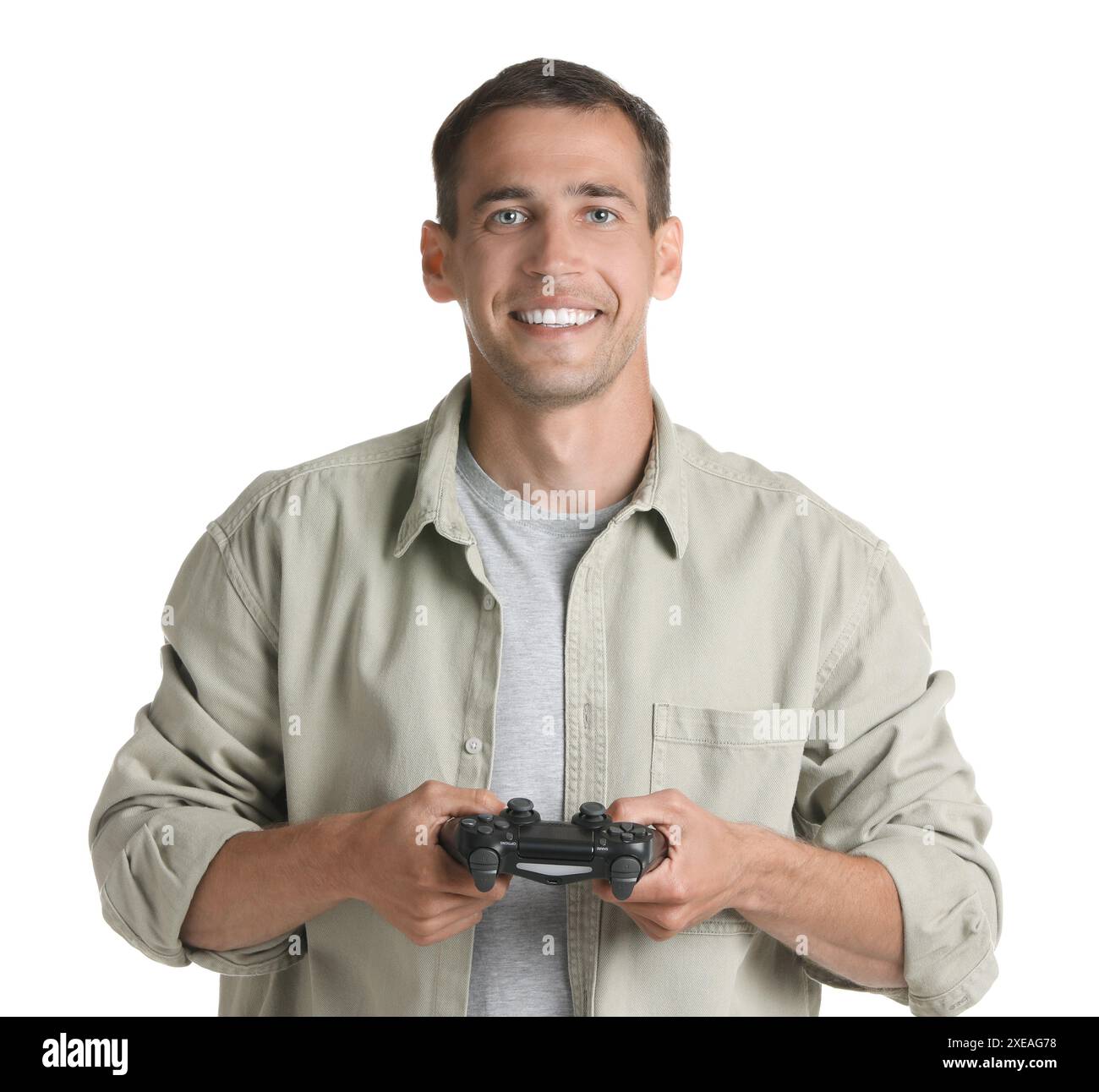 Happy man playing video games with controller on white background Stock ...
