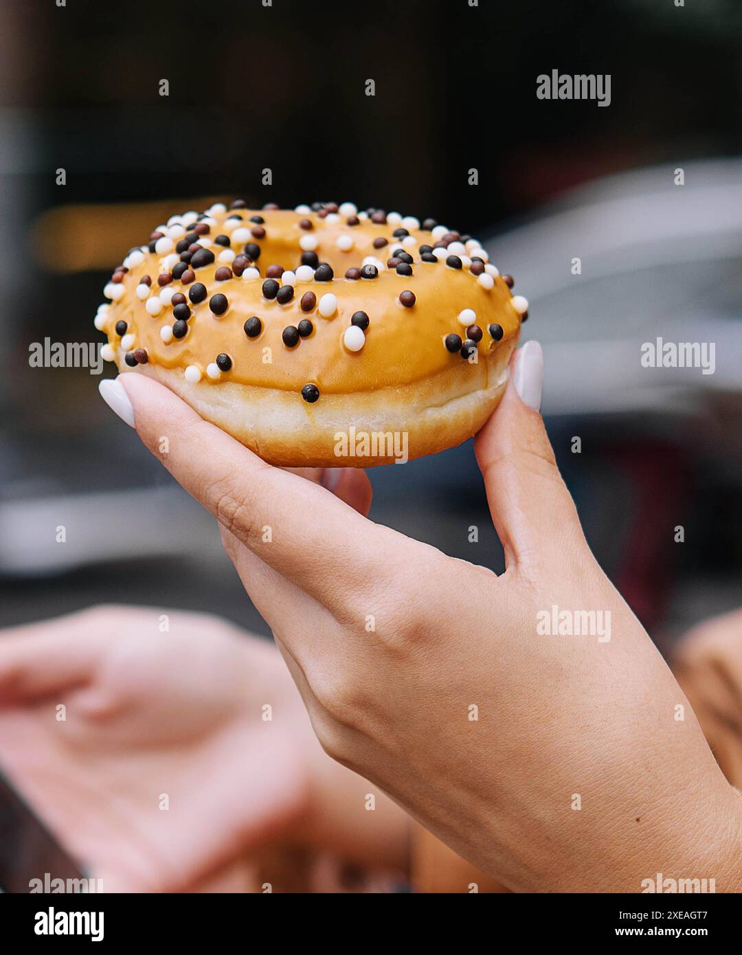 Woman eating donuts hi-res stock photography and images - Alamy
