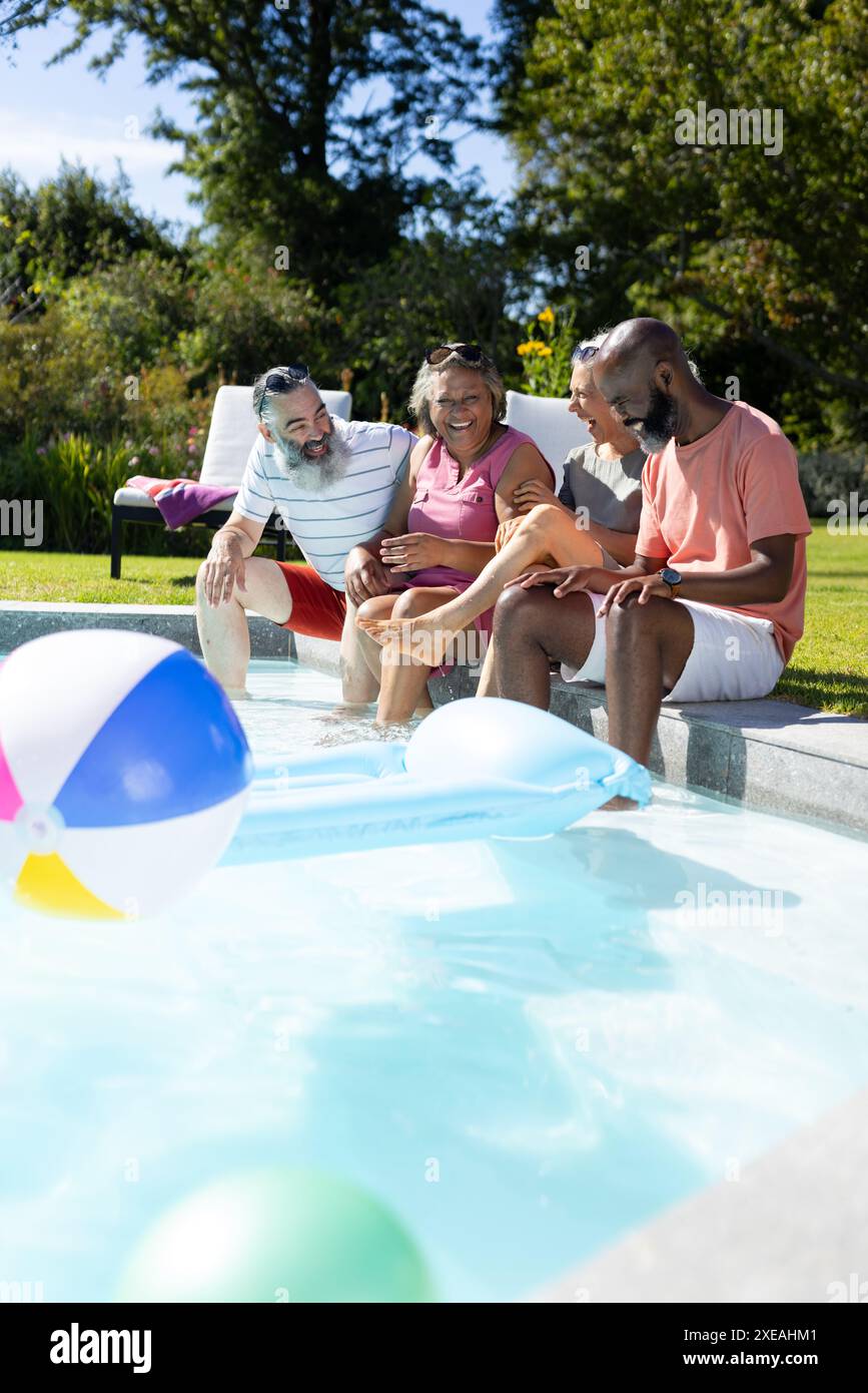 Group cheerful friends sitting hi-res stock photography and images - Alamy