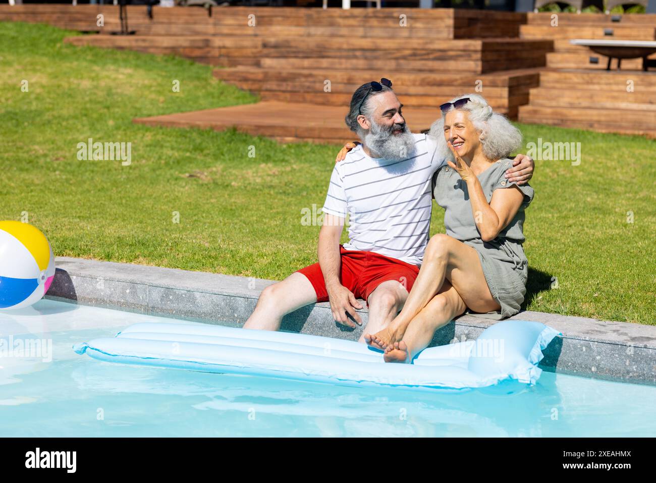 Elderly couple relaxing pool enjoying hi-res stock photography and ...
