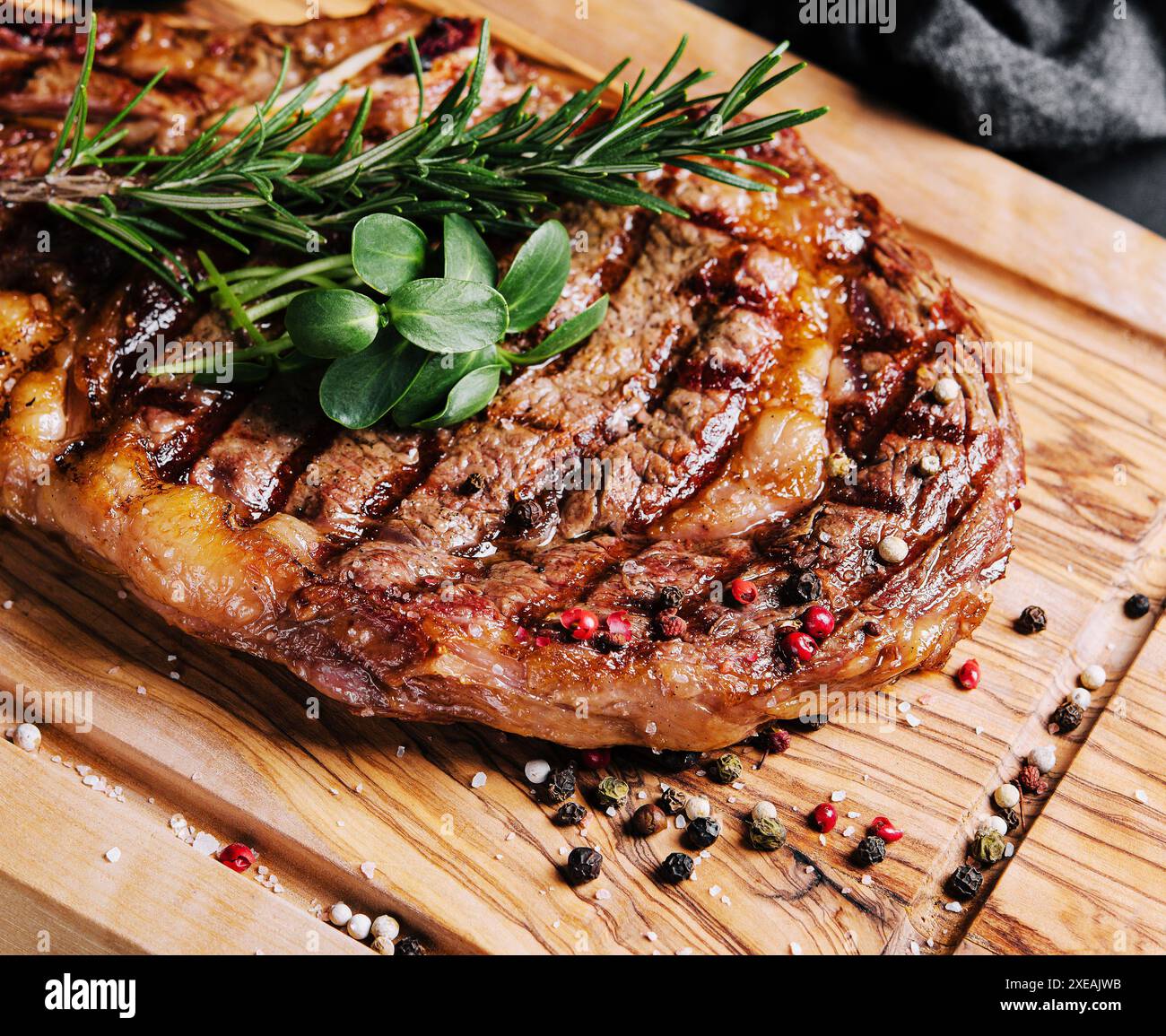 Beef rump steak on black stone table Stock Photo - Alamy