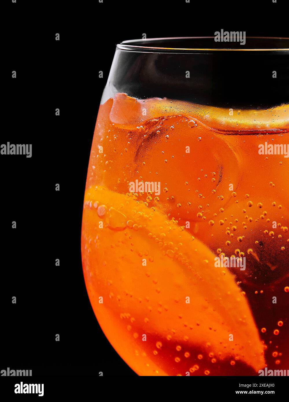 Glass of aperol spritz cocktail on black background Stock Photo - Alamy