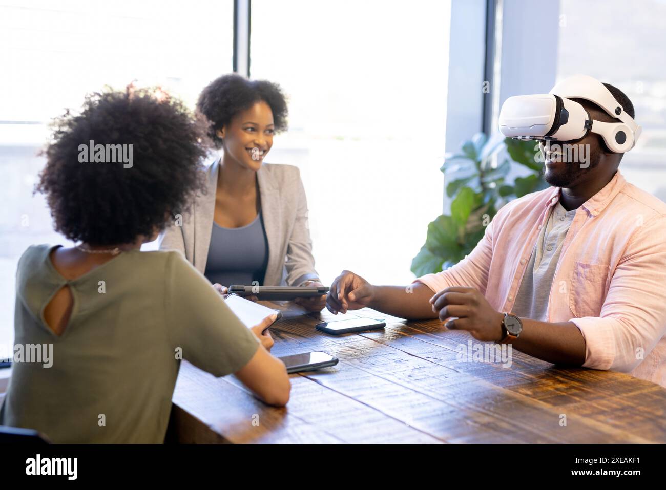 Tech colleagues collaborating office hi-res stock photography and ...