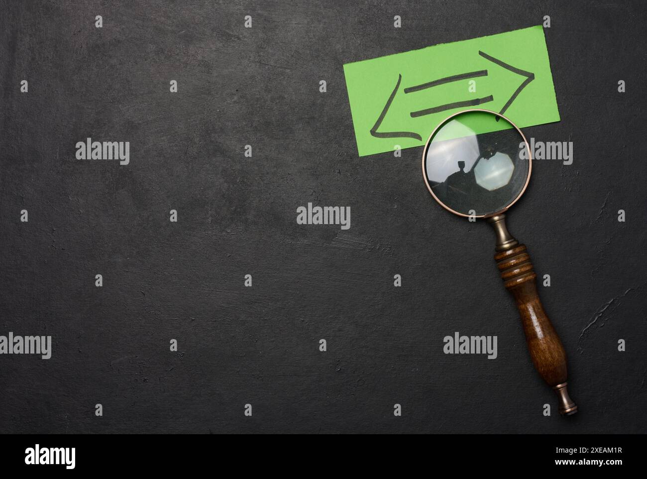 Magnifying glass and paper sheet with arrows pointing in different ...