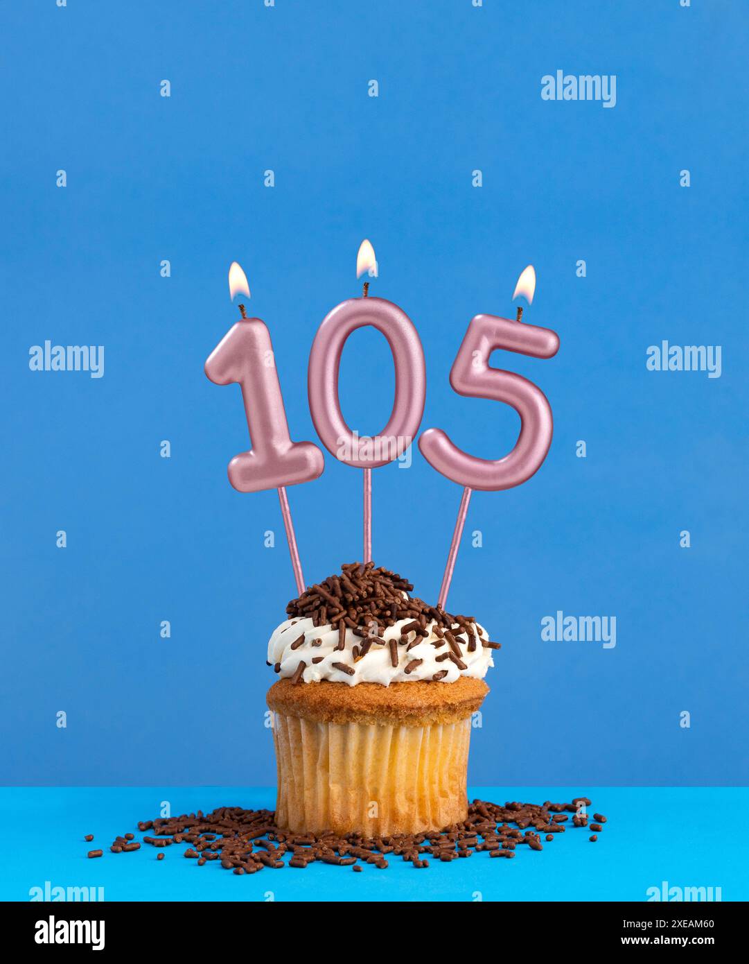 Birthday candle with cupcake on blue background - Number 105 Stock ...