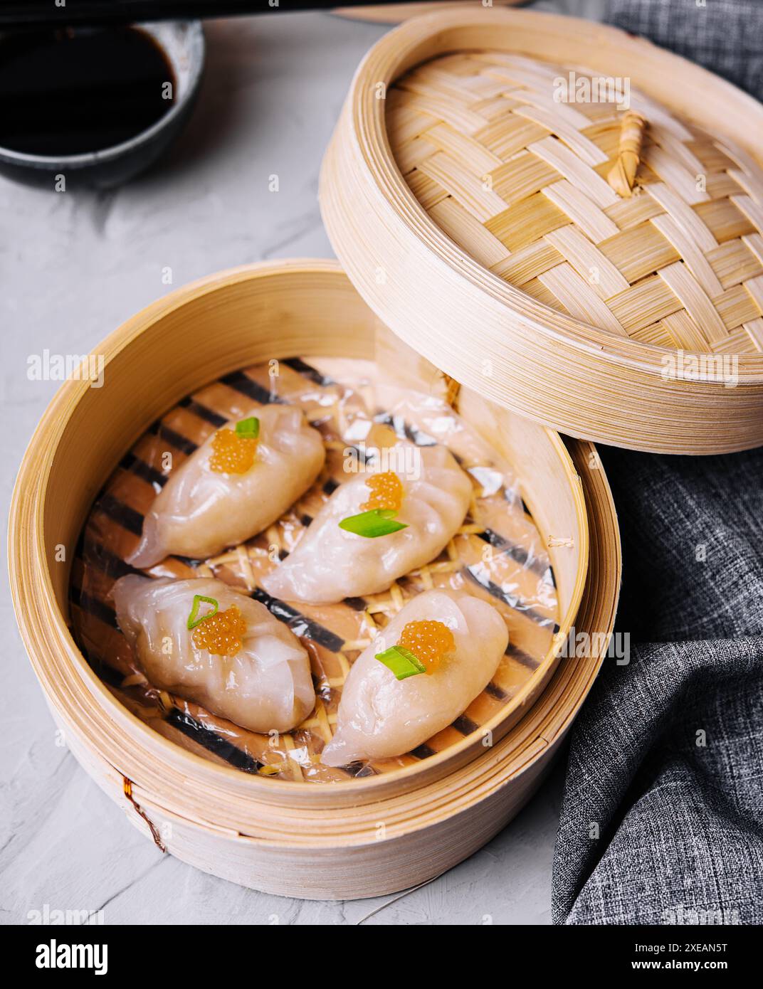 Steamed shrimp dumplings dim sum with pike caviar Stock Photo - Alamy