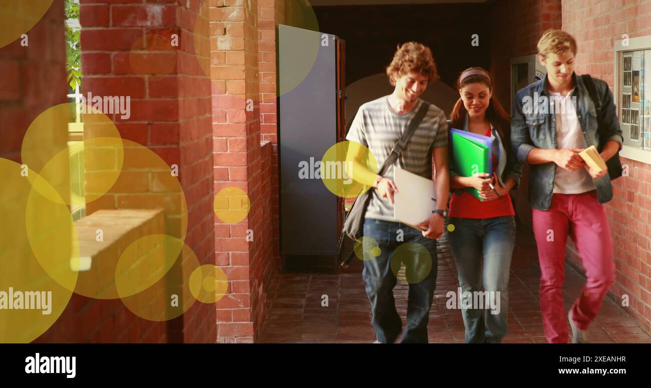 Image of yellow circles floating over caucasian female and male ...